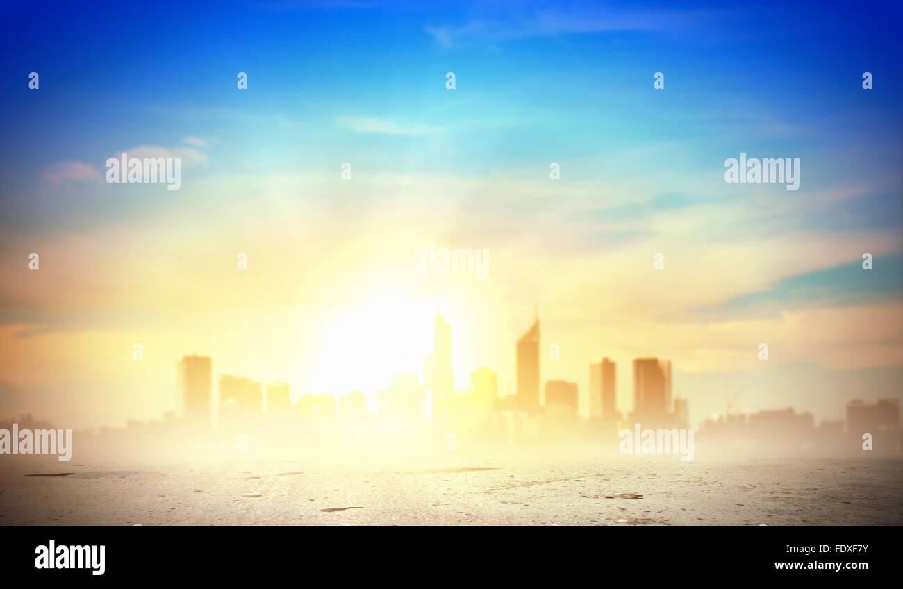 Image of sun rising above the town Stock Photo - Alamy