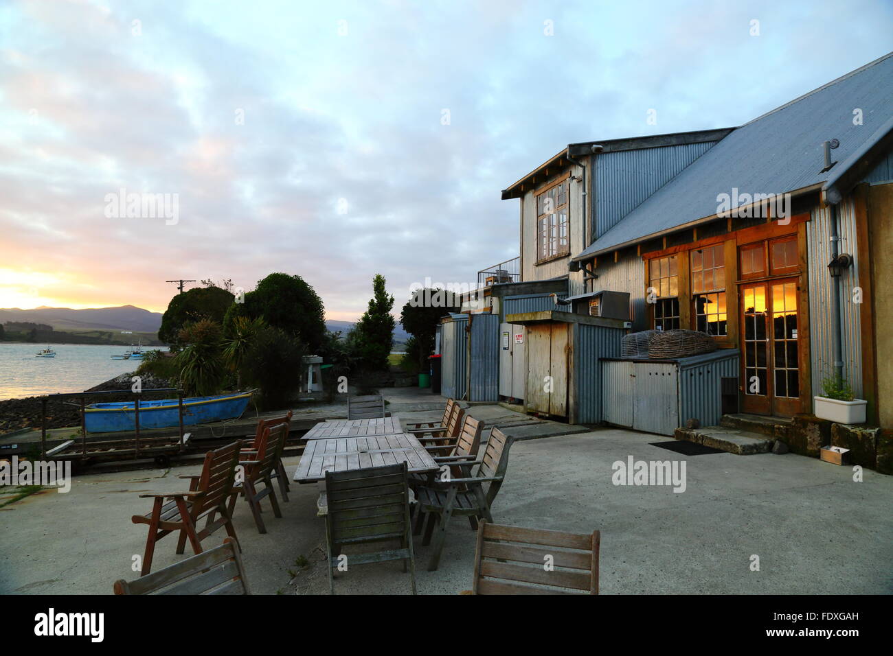 Sunset reflecting in the glass doors of the famous restaurant called ...