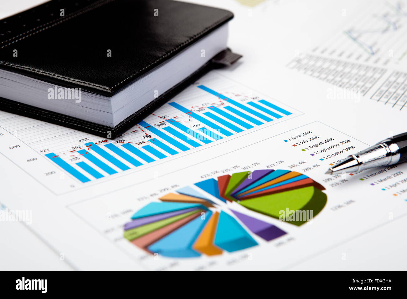 financial charts and graphs on the table Stock Photo - Alamy