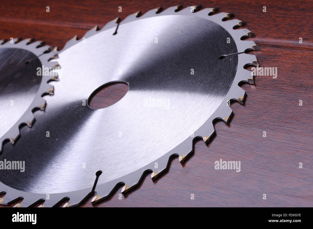 The metal disc is a circular saw on a dark background Stock Photo - Alamy