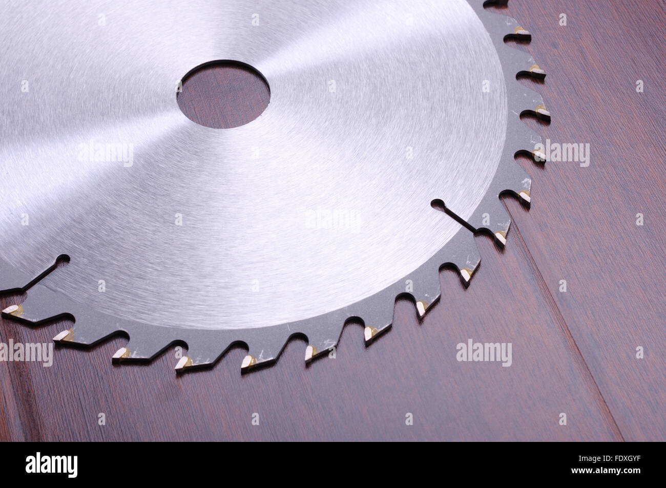 The metal disc is a circular saw on a dark background Stock Photo - Alamy