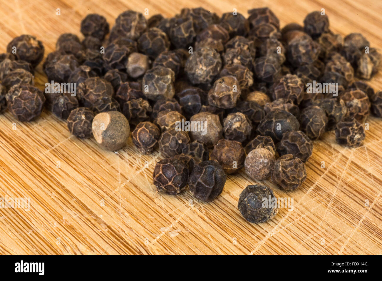 closeup of pile of whole black pepper Stock Photo - Alamy