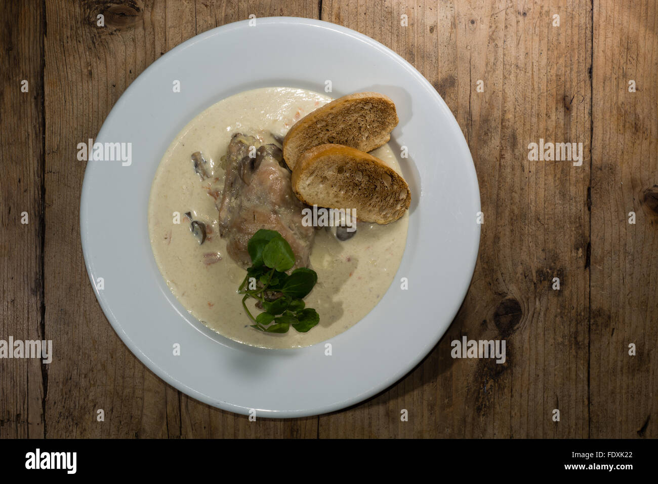 A classic French dish of rabbit in a mustard sauce Stock Photo - Alamy