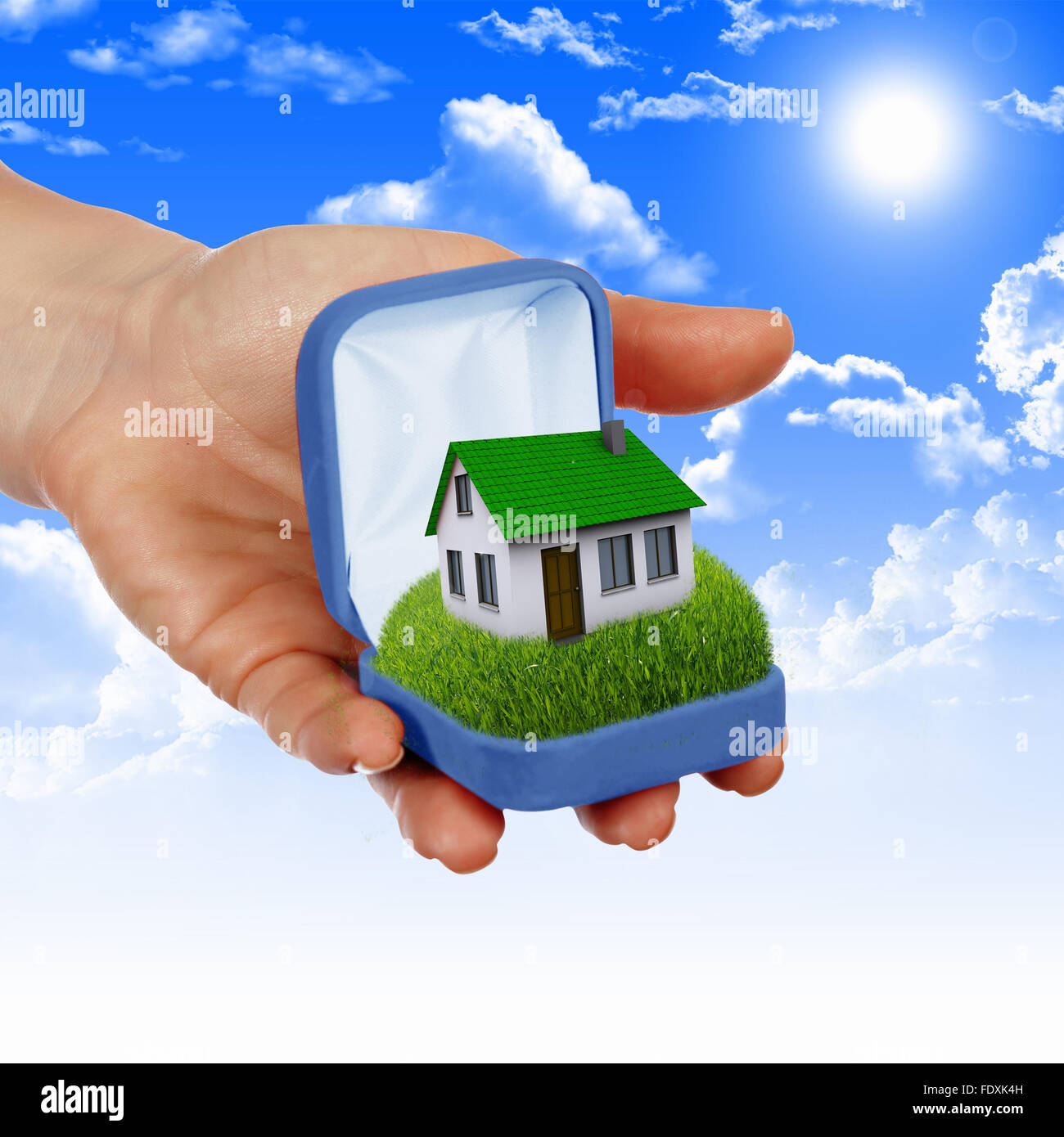 Human hand against blue sky background and house Stock Photo - Alamy