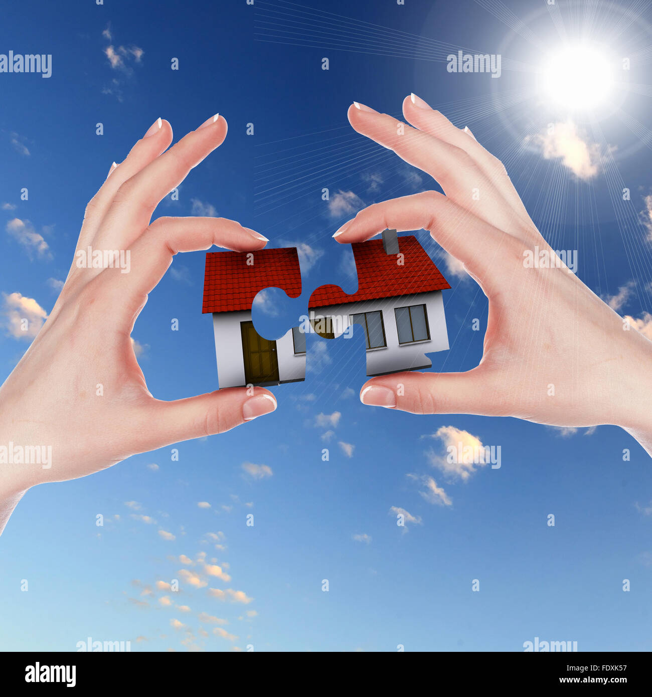 Human hand against blue sky background and house Stock Photo - Alamy