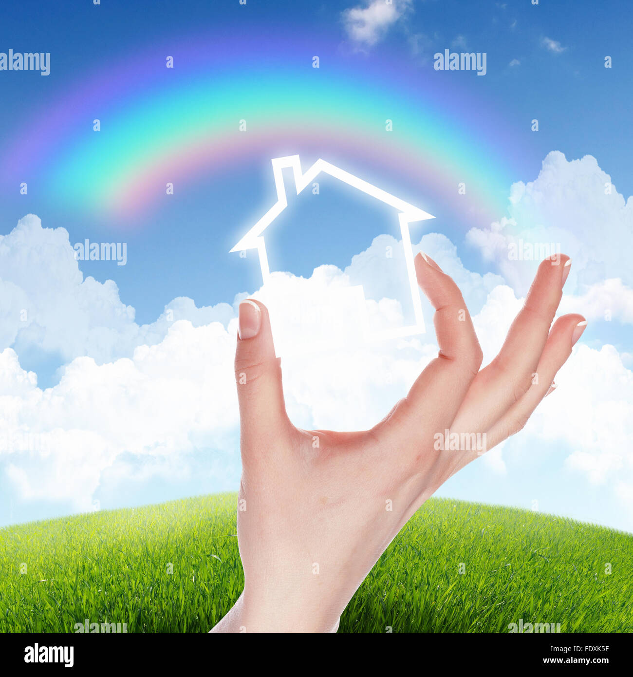Human hand against blue sky background and house Stock Photo - Alamy