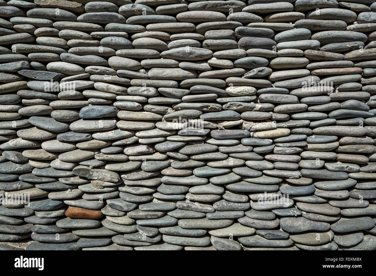 wall from layering stones Stock Photo - Alamy