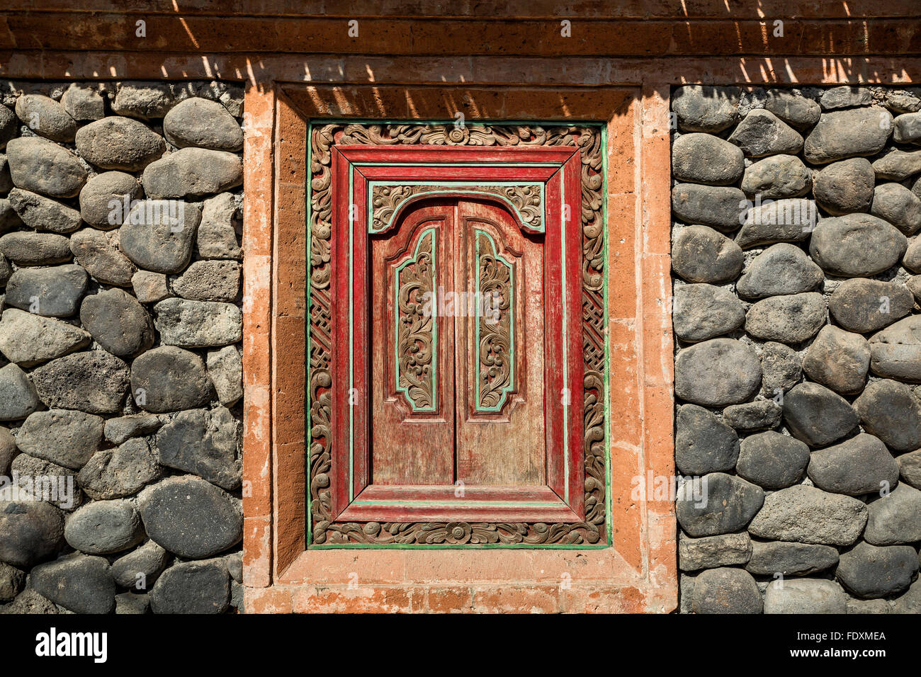 Bali Ethnic wooden crafted window Stock Photo - Alamy