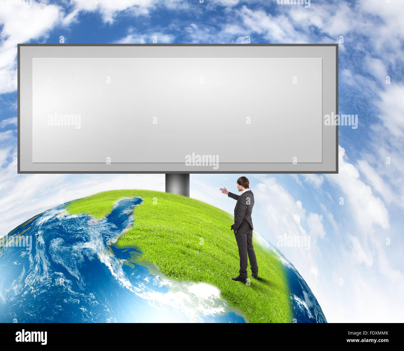 Business person standing near a blank billboard Stock Photo - Alamy