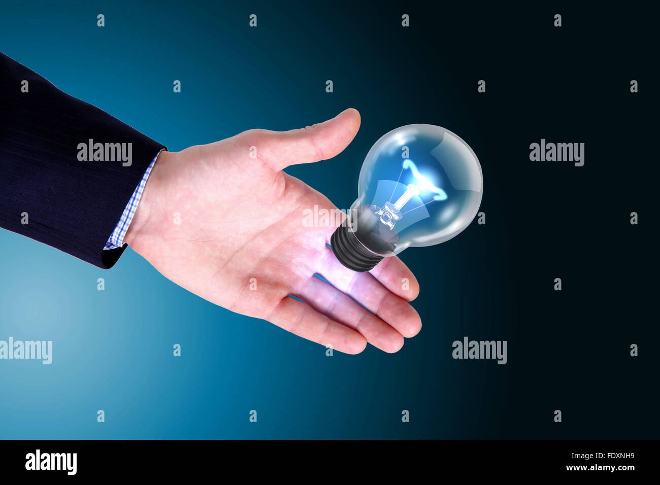 Human hand holding a shining electric bulb Stock Photo - Alamy