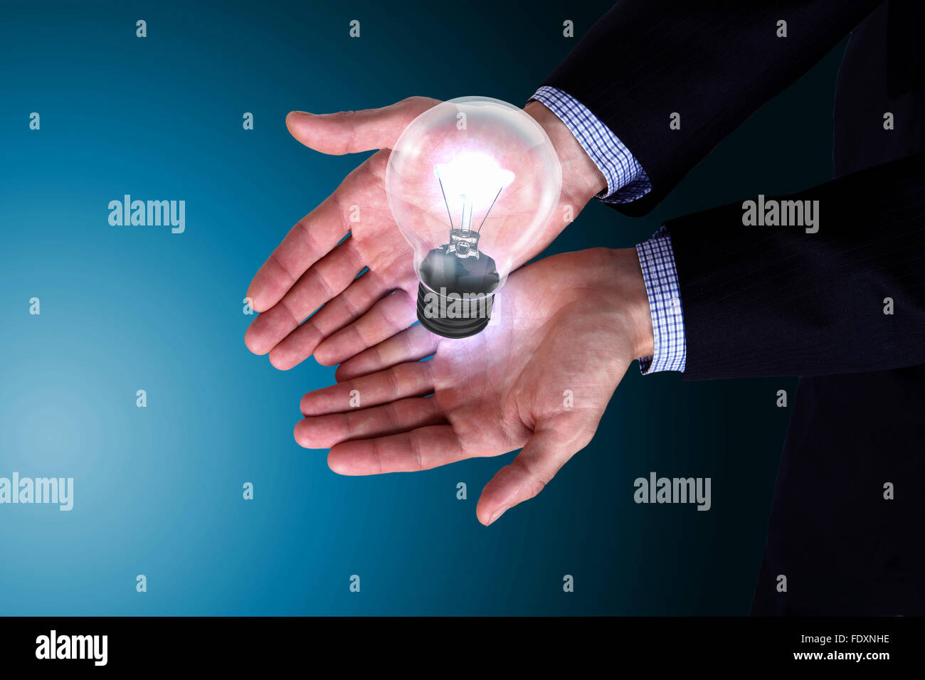 Human hand holding a shining electric bulb Stock Photo - Alamy