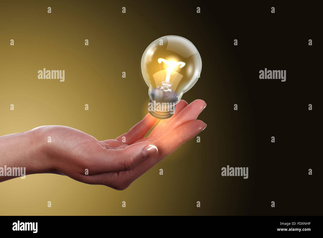Human hand holding a shining electric bulb Stock Photo - Alamy