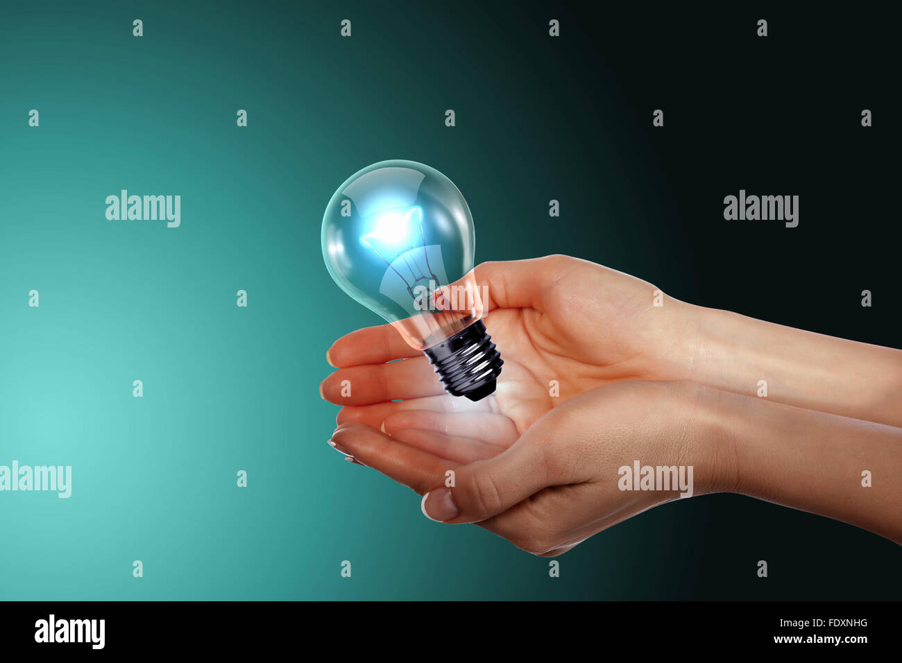 Human hand holding a shining electric bulb Stock Photo - Alamy