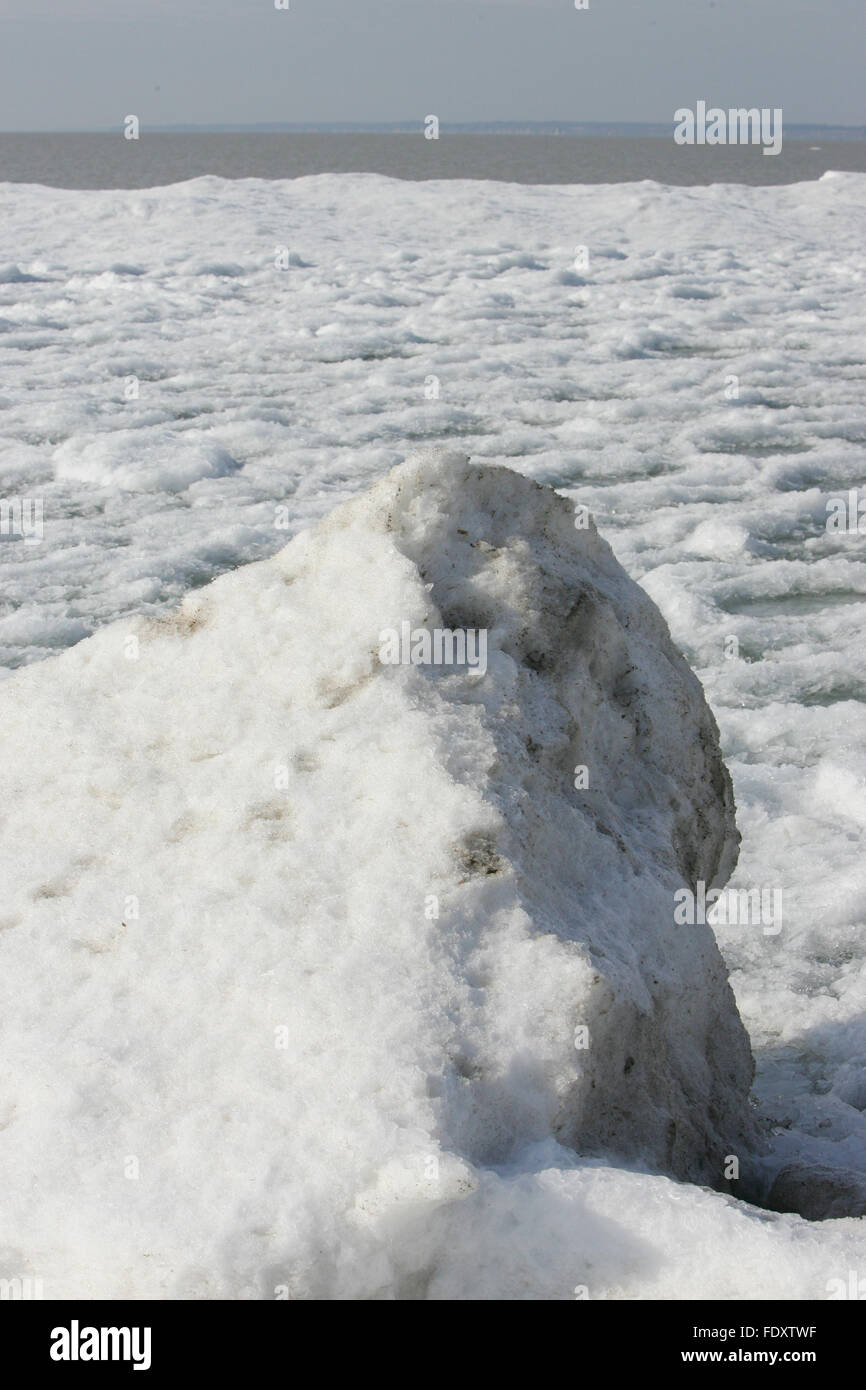 Port Stanley Beach Shore is frozen with ice bolder laying on top Stock ...