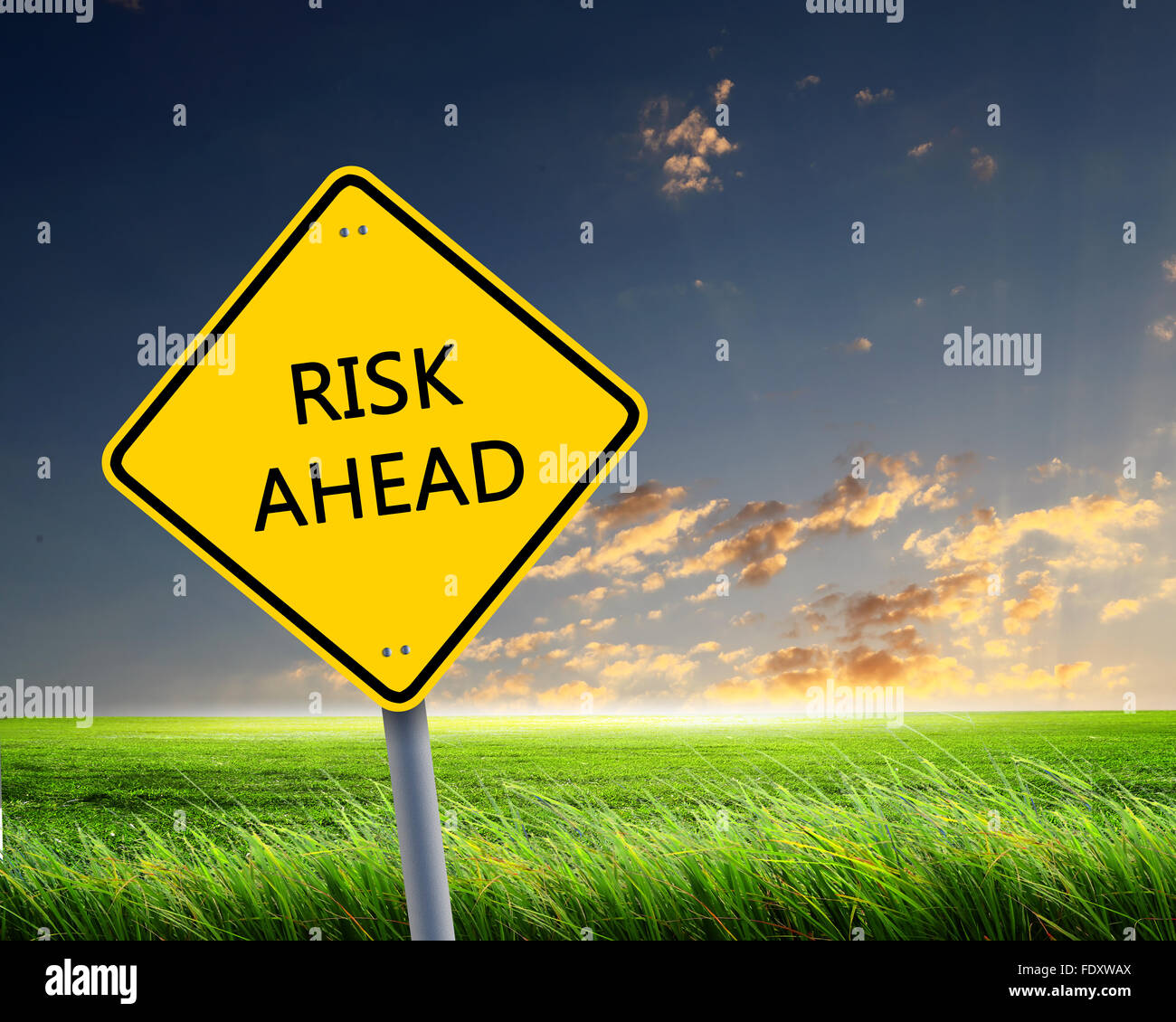 yellow road sign as a warning of risk ahead Stock Photo - Alamy
