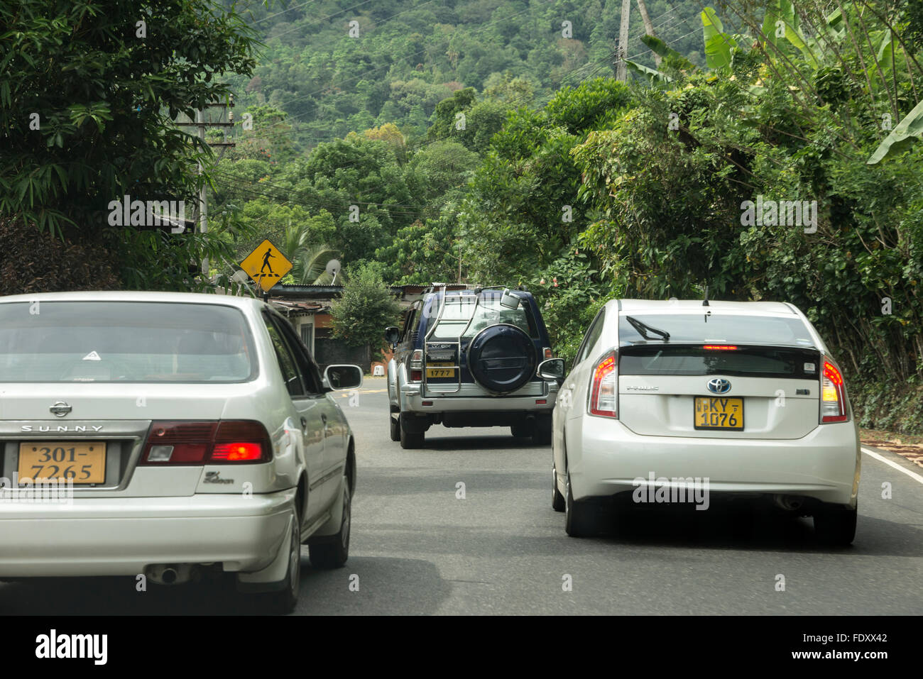 Two speeding motorists overtaking another vehicle whilst approaching a ...