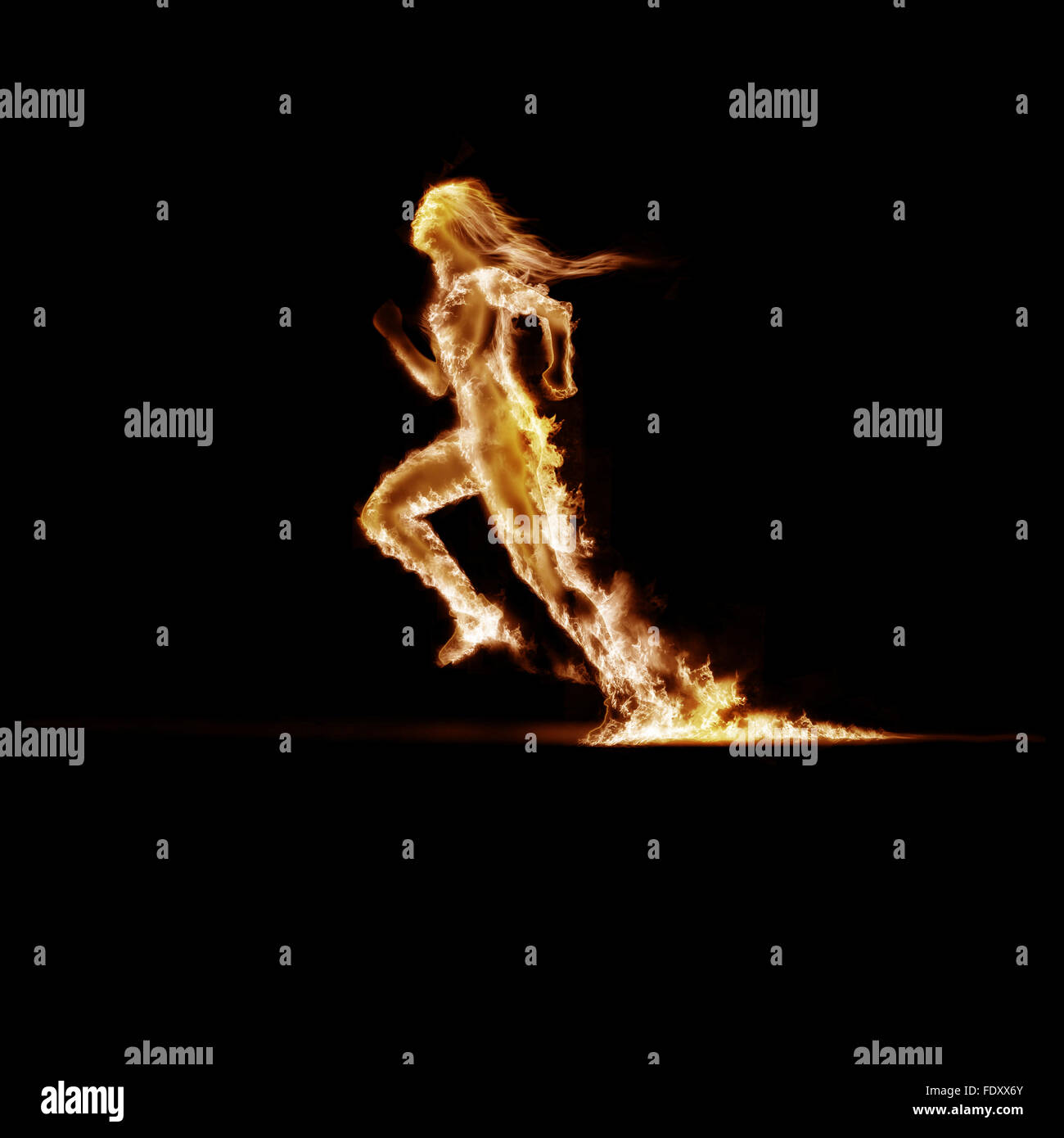 Running Man, enveloped in flames on a black background Stock Photo - Alamy