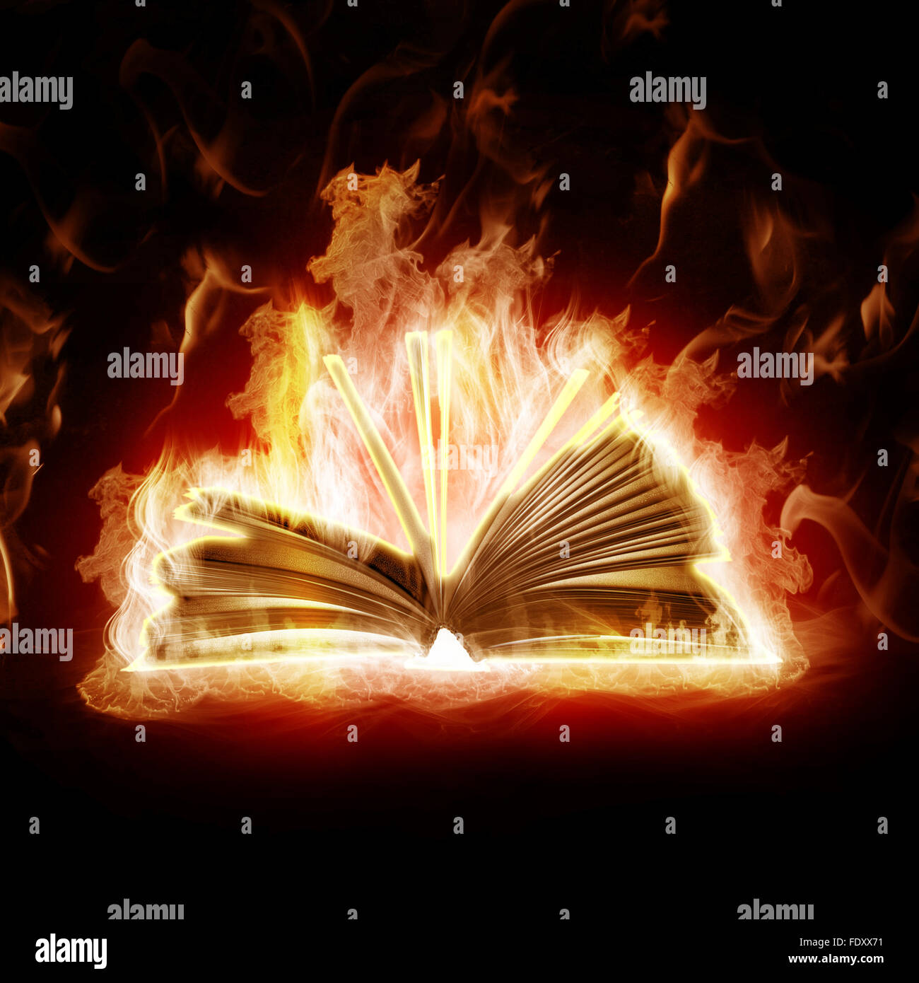 Mysterious Book open arms fire on a black background Stock Photo - Alamy