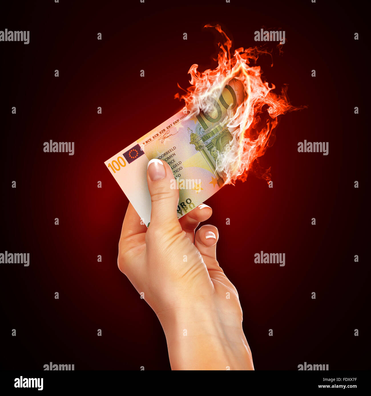 Banknotes open arms fire on a black background Stock Photo - Alamy