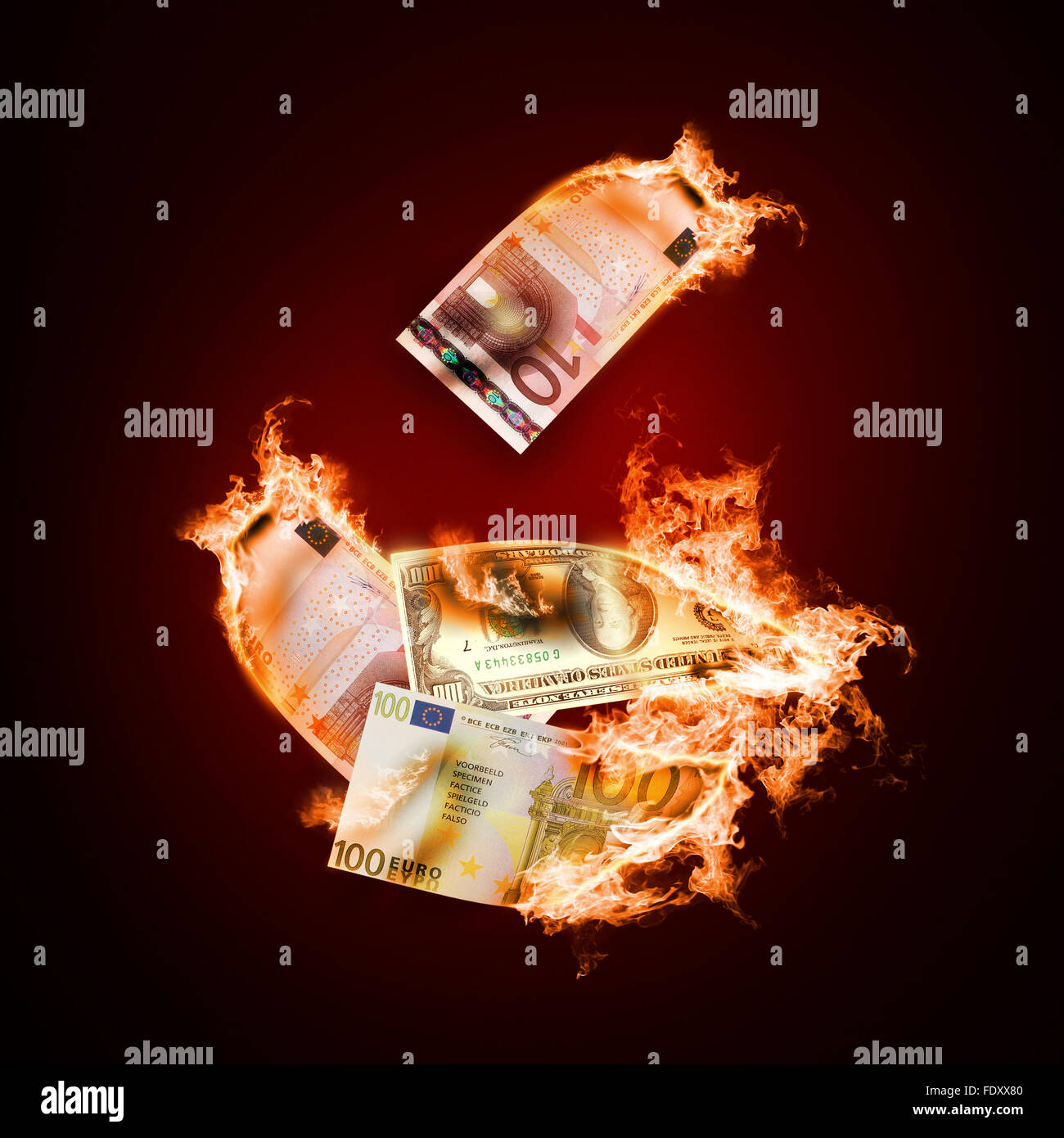 Banknotes open arms fire on a black background Stock Photo - Alamy