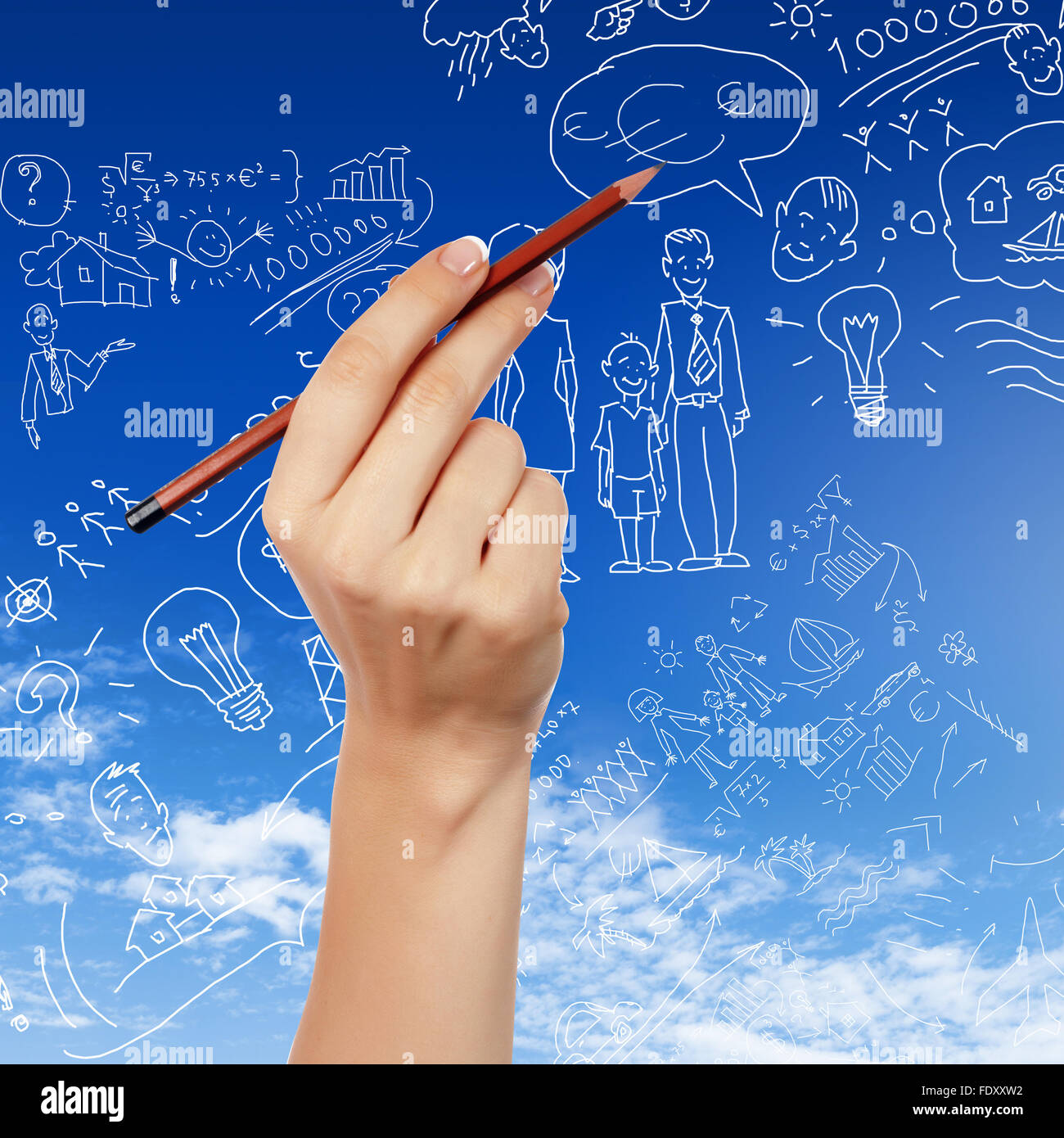 human hand drawing different pictures with pencil on the sky Stock ...