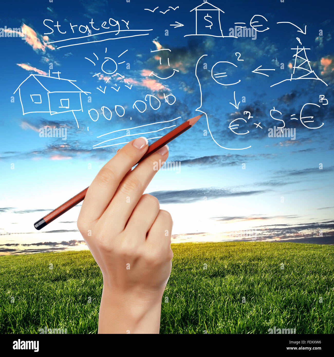 human hand drawing different pictures with pencil on the sky Stock ...