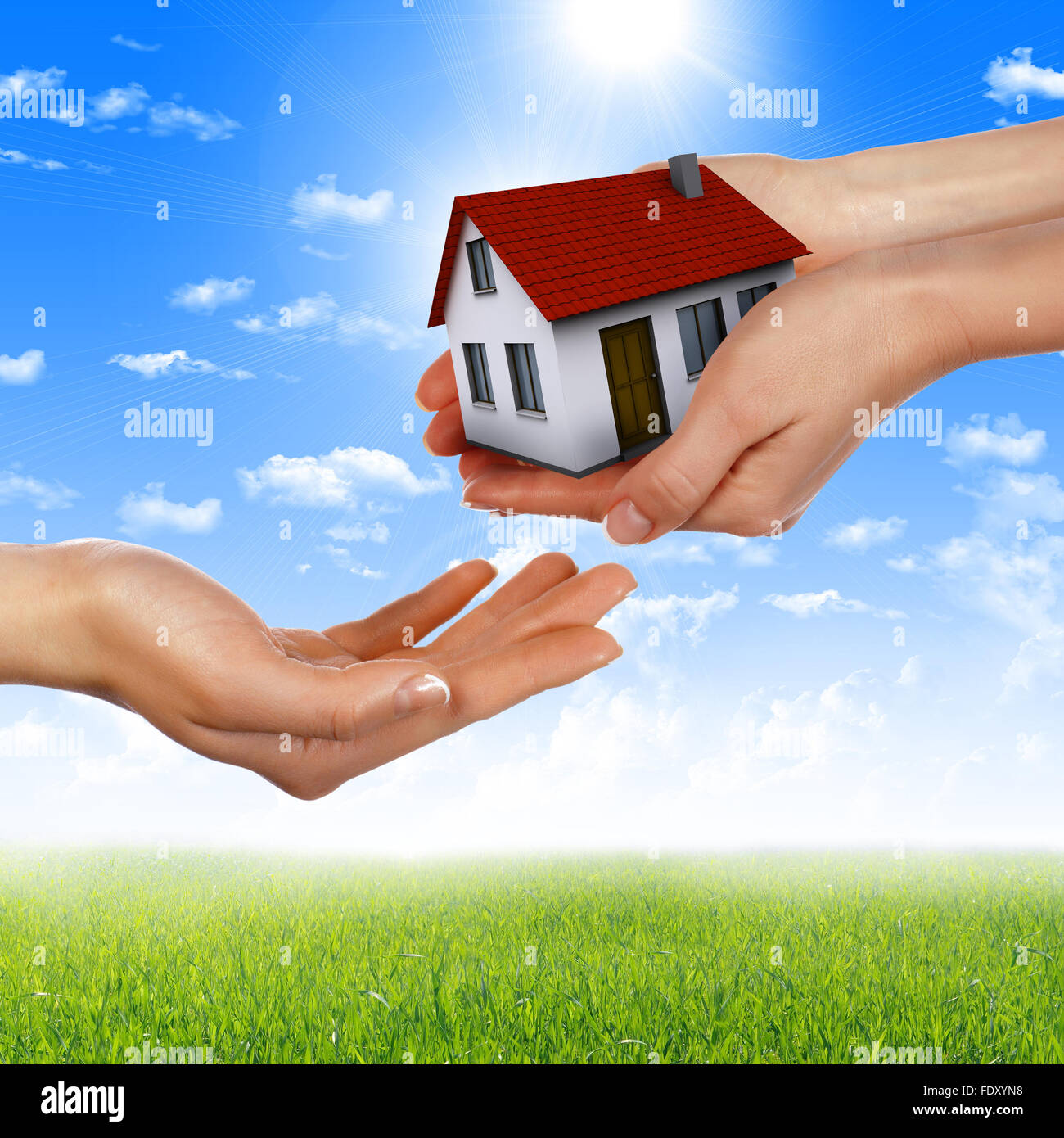 human hands holding model of a house against nature background Stock ...