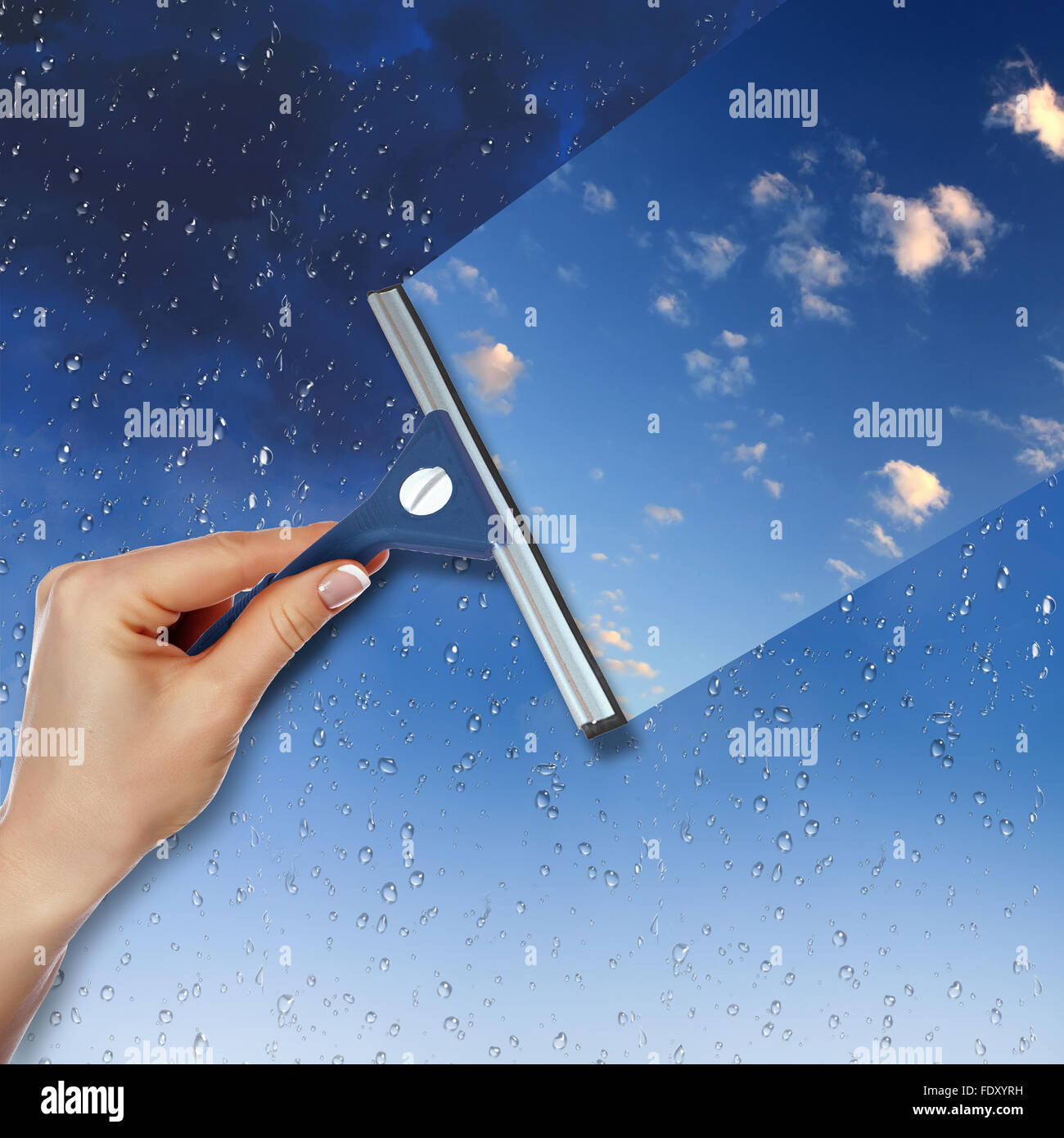 Hand cleaning window with blue sky and white clouds Stock Photo - Alamy