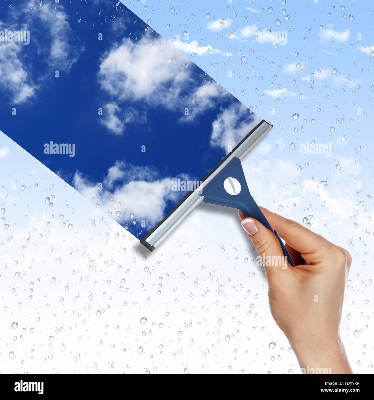 Hand cleaning window with blue sky and white clouds Stock Photo - Alamy