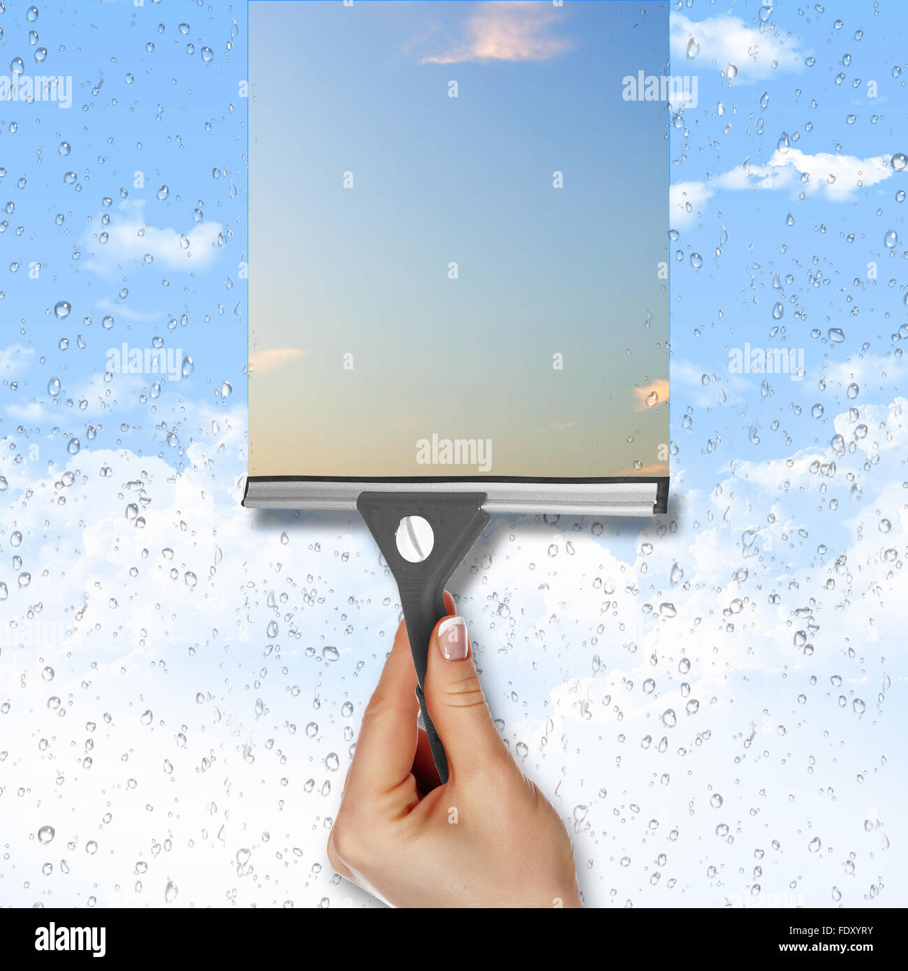 Hand cleaning window with blue sky and white clouds Stock Photo - Alamy