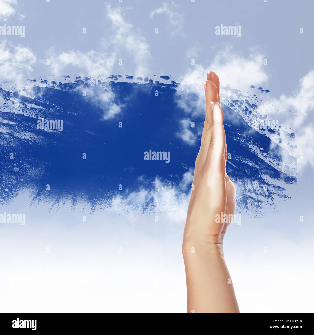 Hand cleaning window with blue sky and white clouds Stock Photo - Alamy