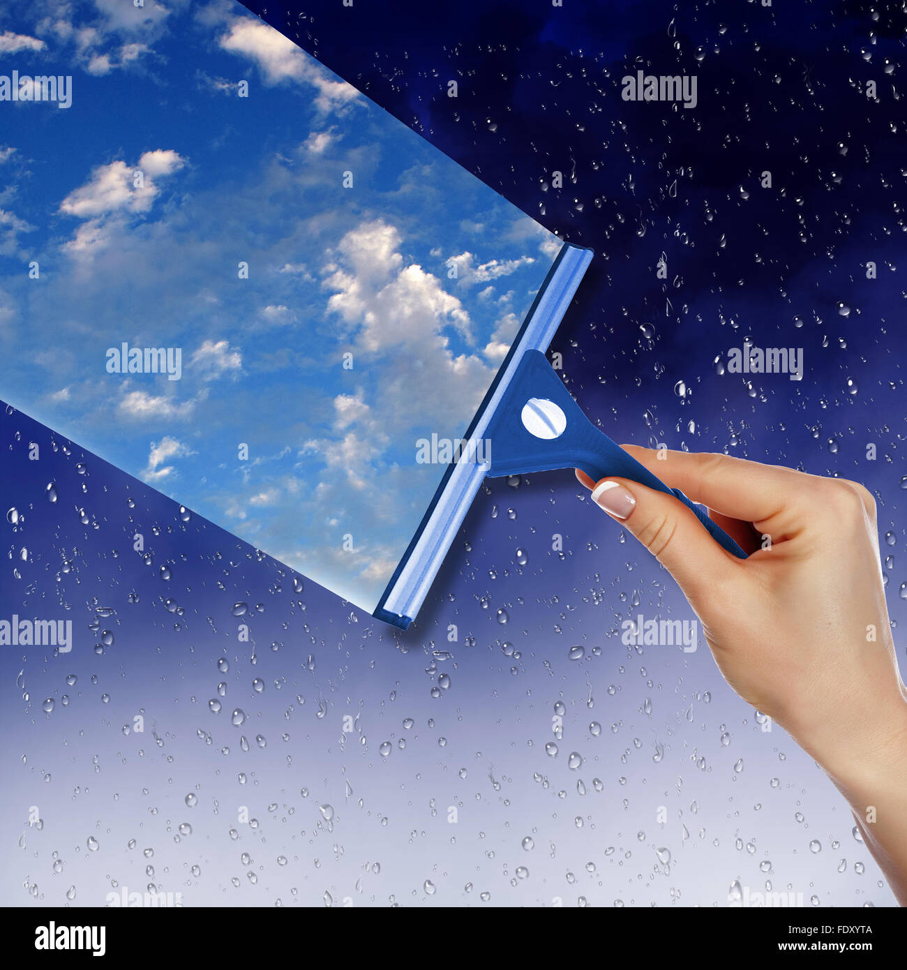 Hand cleaning window with blue sky and white clouds Stock Photo - Alamy