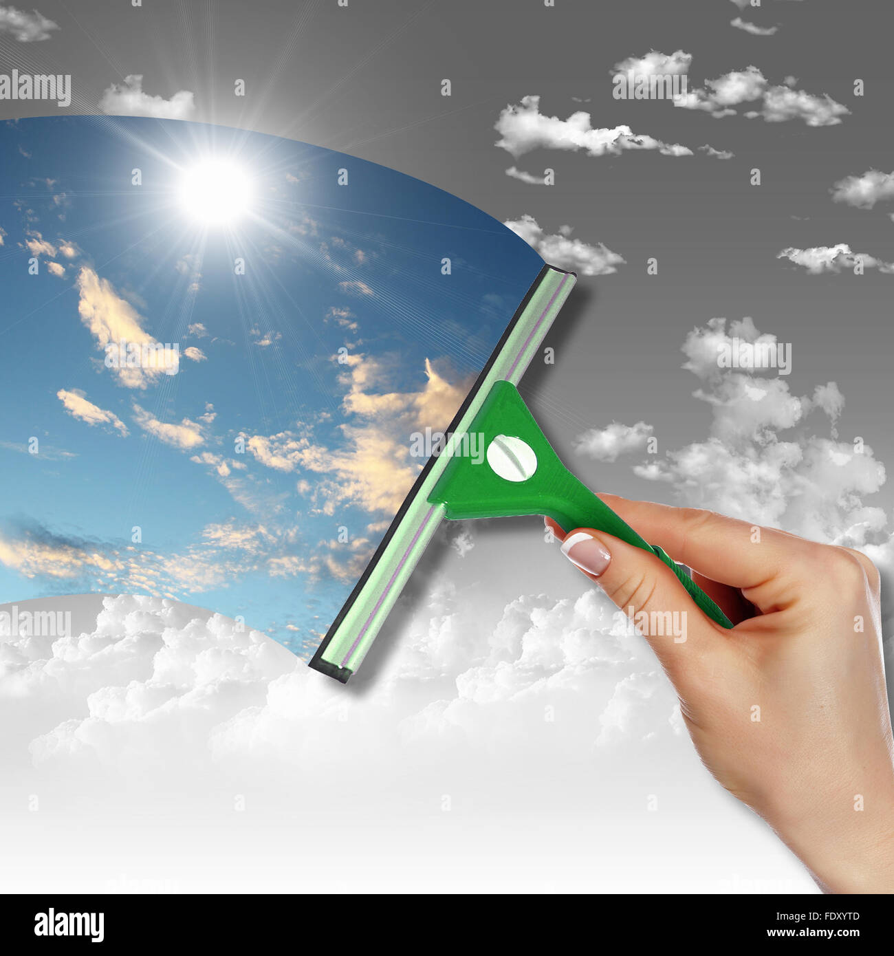 Hand cleaning window with blue sky and white clouds Stock Photo - Alamy