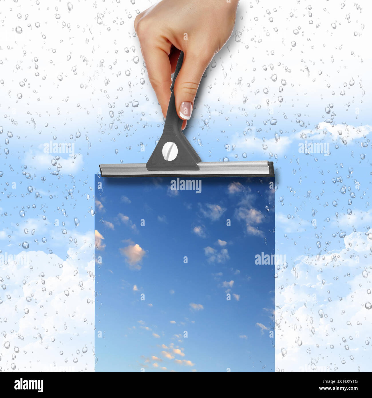 Hand cleaning window with blue sky and white clouds Stock Photo - Alamy