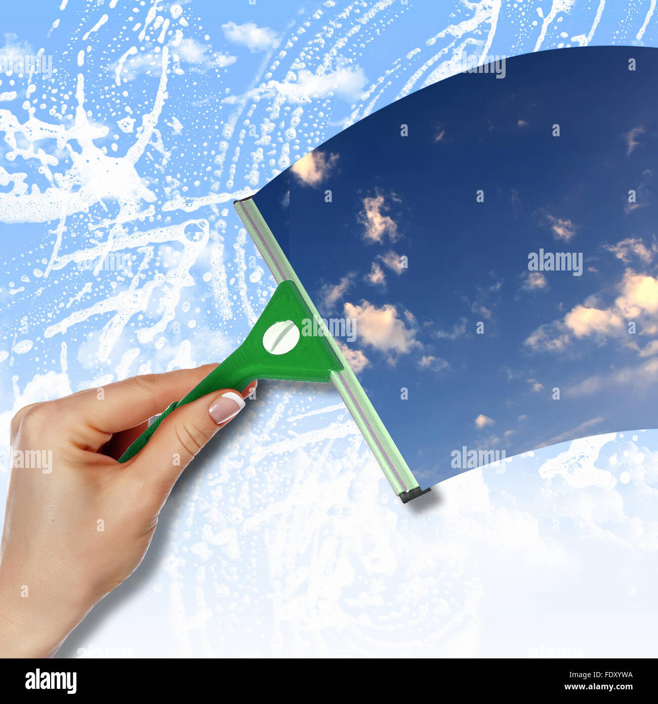 Hand cleaning window with blue sky and white clouds Stock Photo - Alamy