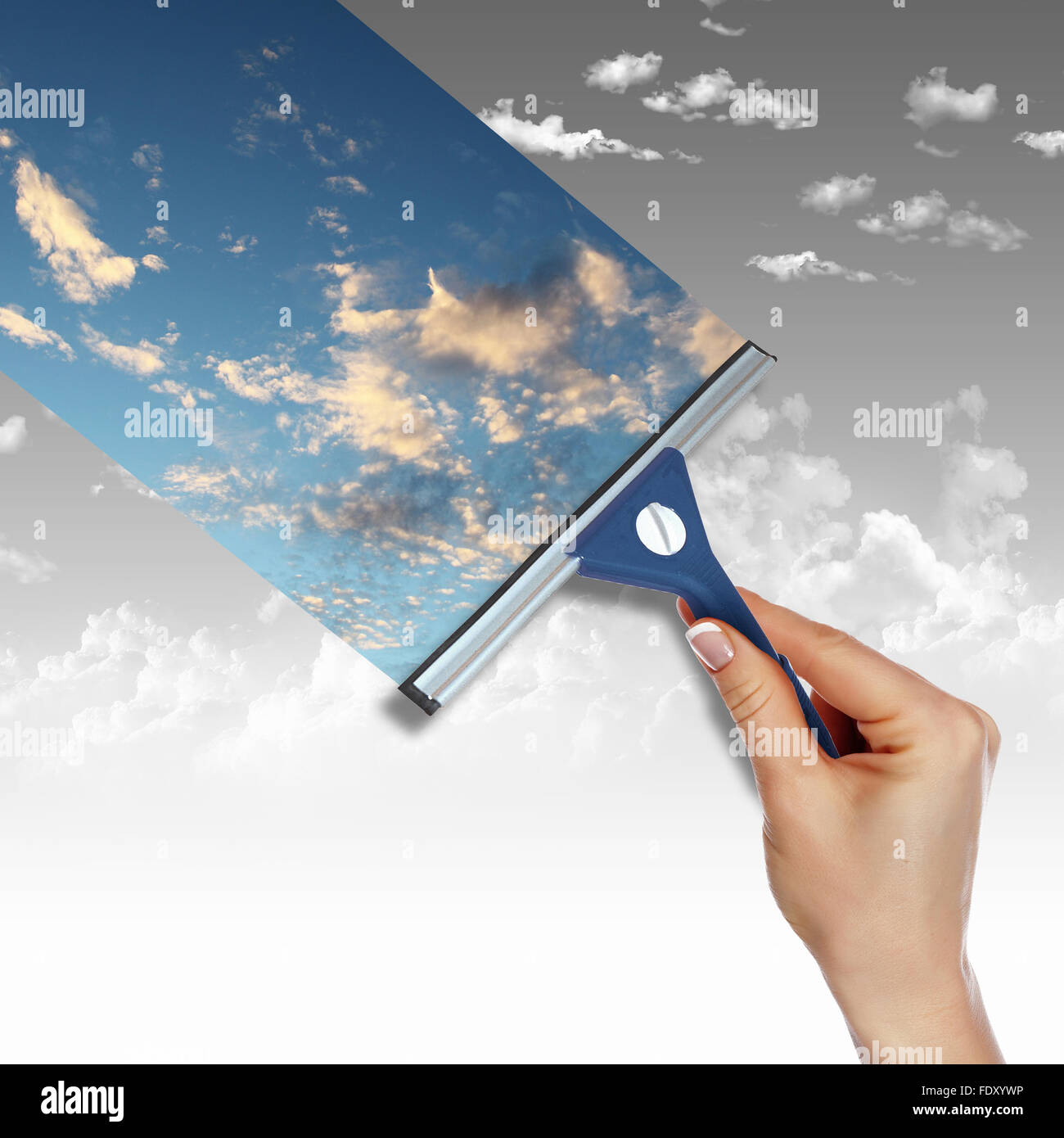 Hand cleaning window with blue sky and white clouds Stock Photo - Alamy