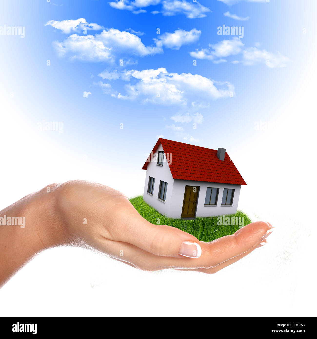 The House in the hands against the blue sky as a symbol of the real ...