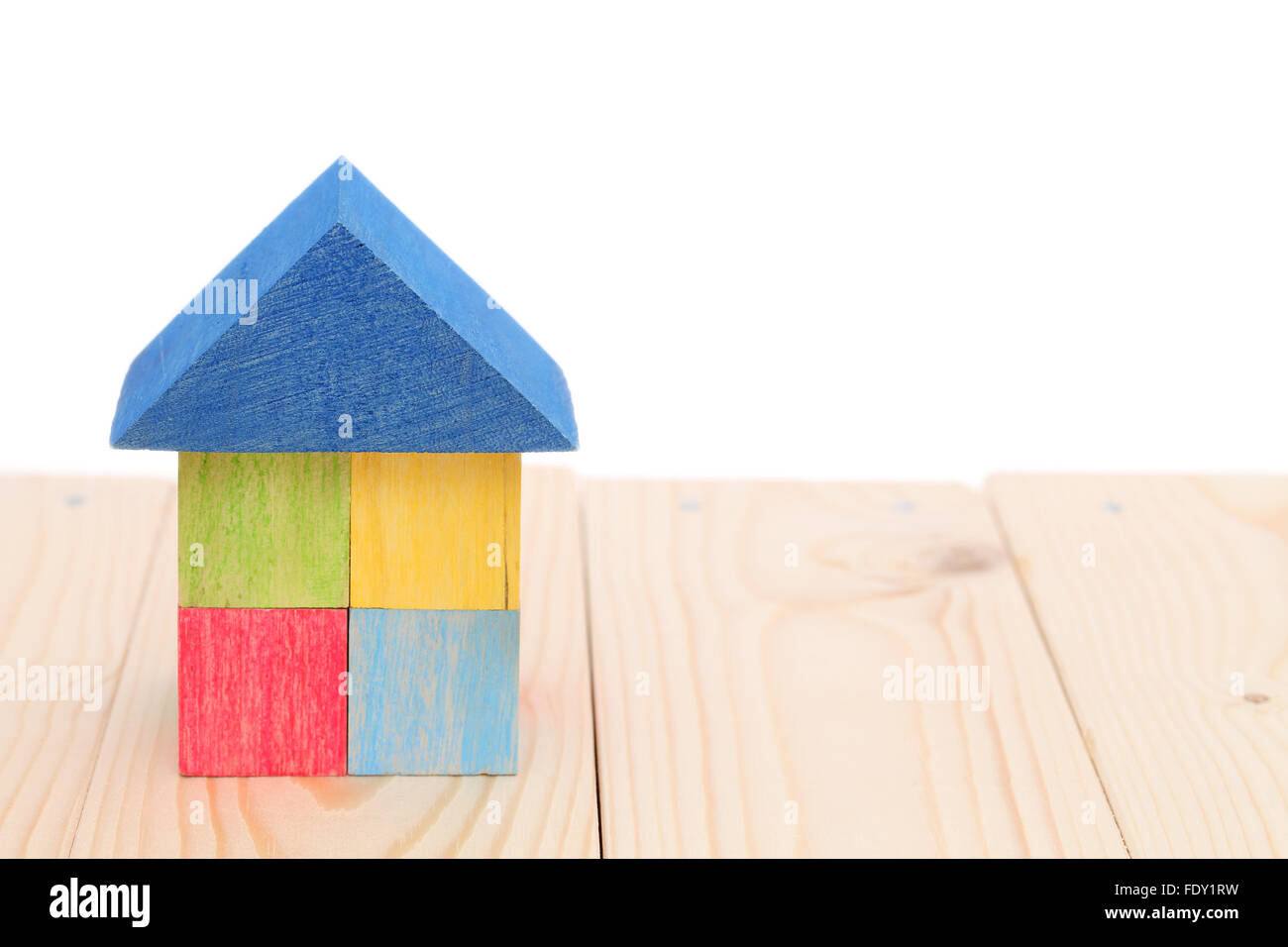 wooden toy house with colored toy blocks Stock Photo - Alamy