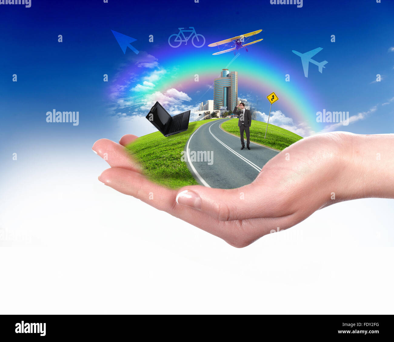 Collage with a human hand holding a green landscape Stock Photo - Alamy