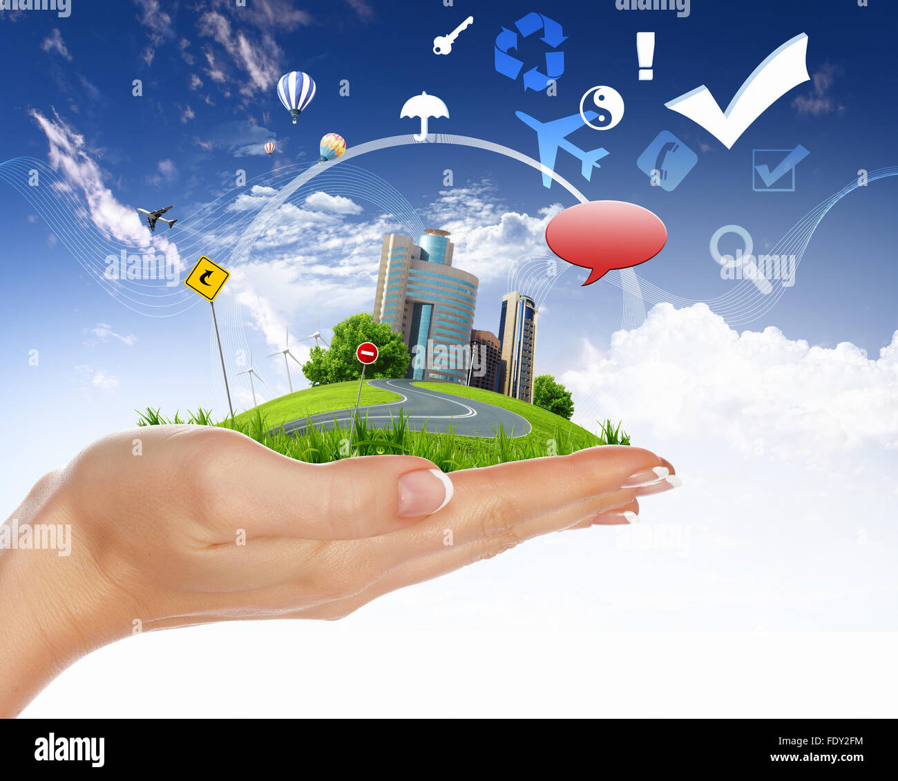 Collage with a human hand holding a green landscape Stock Photo - Alamy