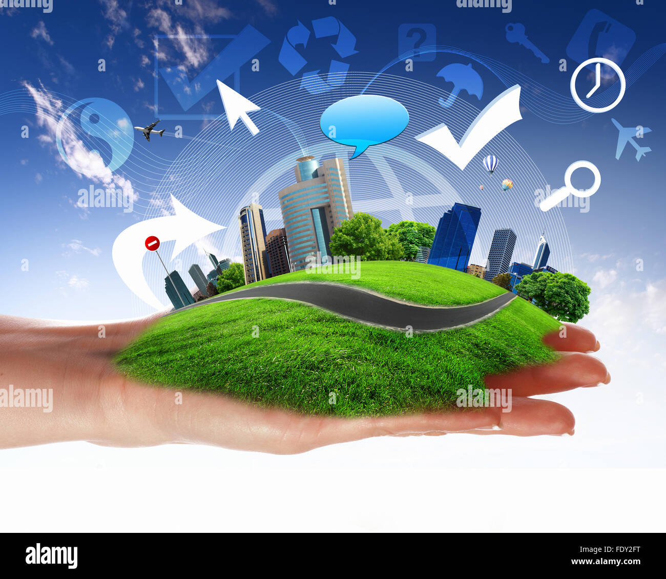 Collage with a human hand holding a green landscape Stock Photo - Alamy