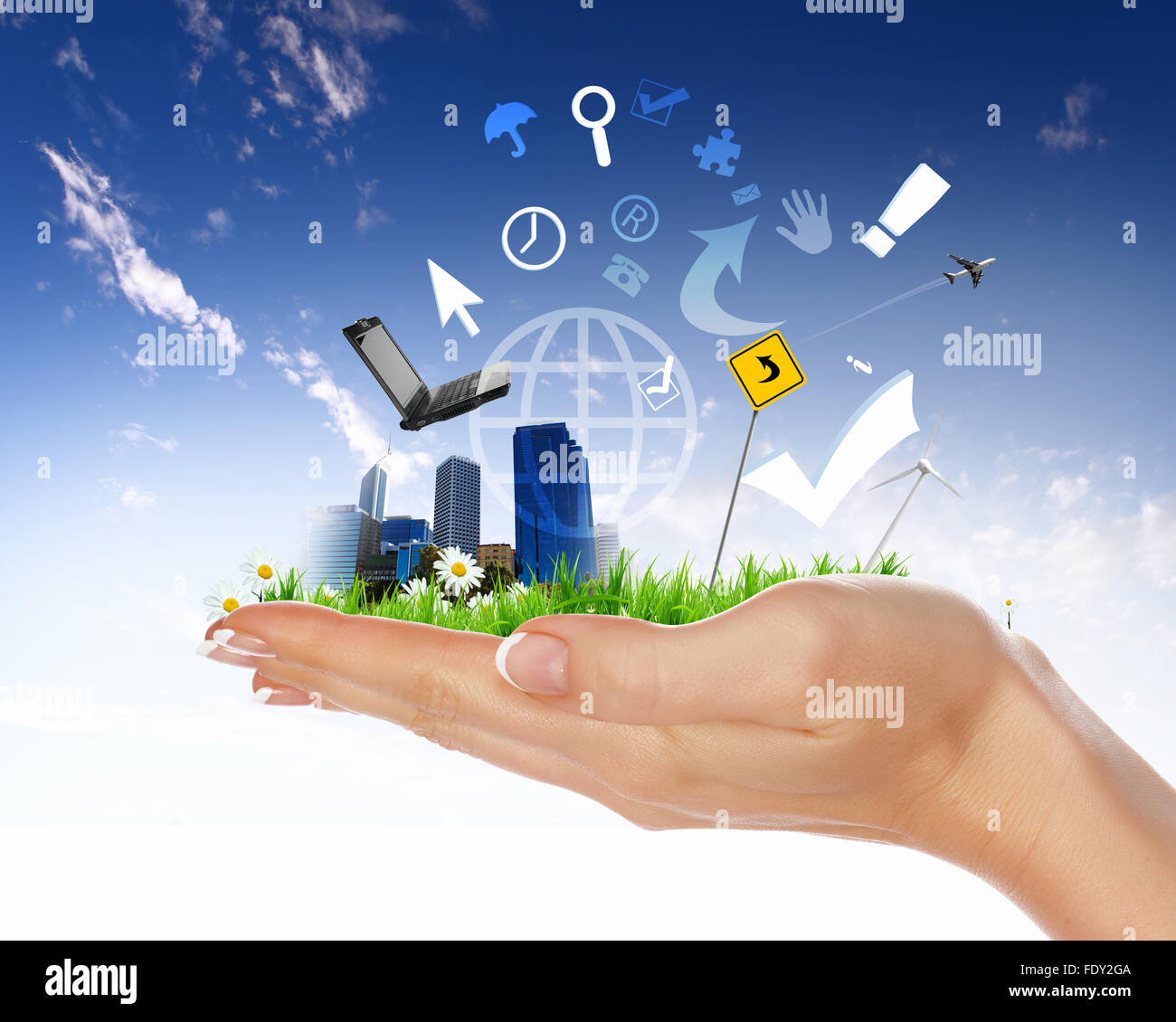 Collage with a human hand holding a green landscape Stock Photo - Alamy