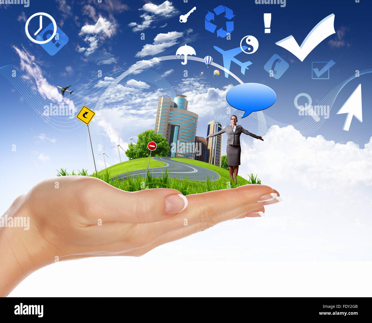 Collage with a human hand holding a green landscape Stock Photo - Alamy