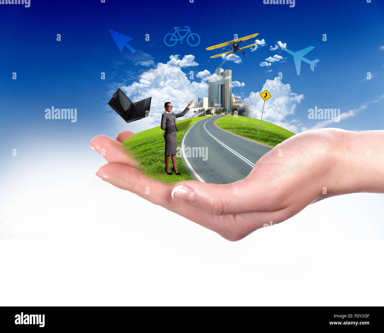 Collage with a human hand holding a green landscape Stock Photo - Alamy