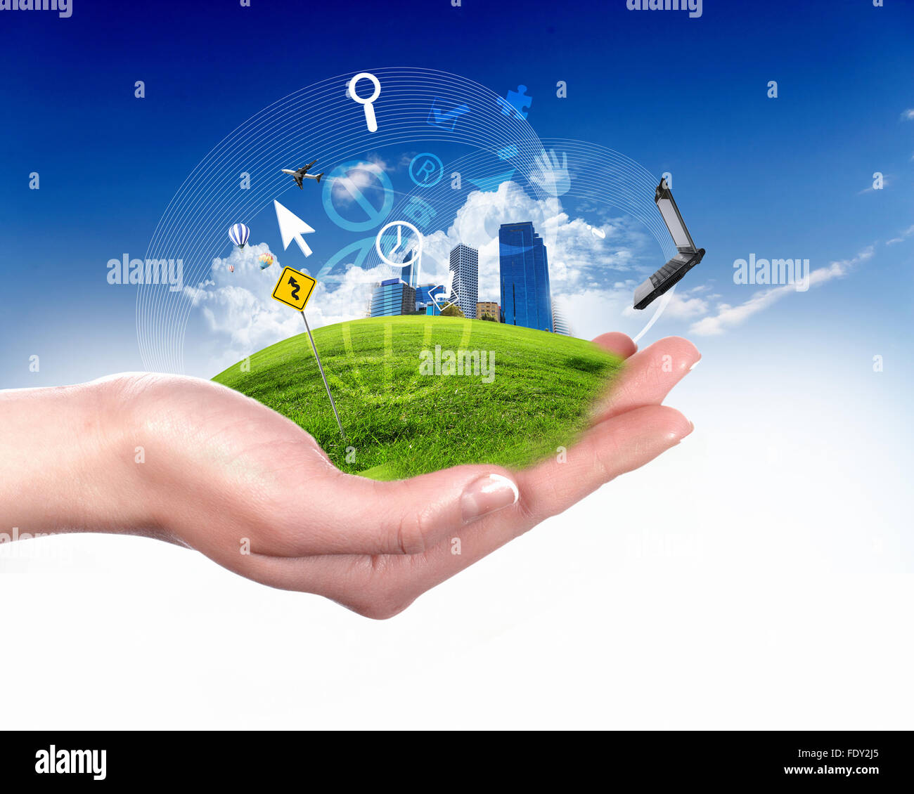 Collage with a human hand holding a green landscape Stock Photo - Alamy