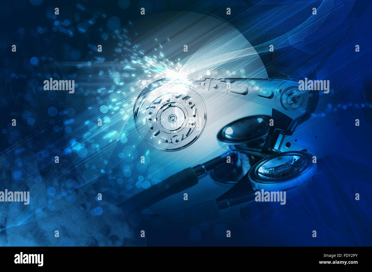 Hard drive with an abstract blue background Stock Photo - Alamy