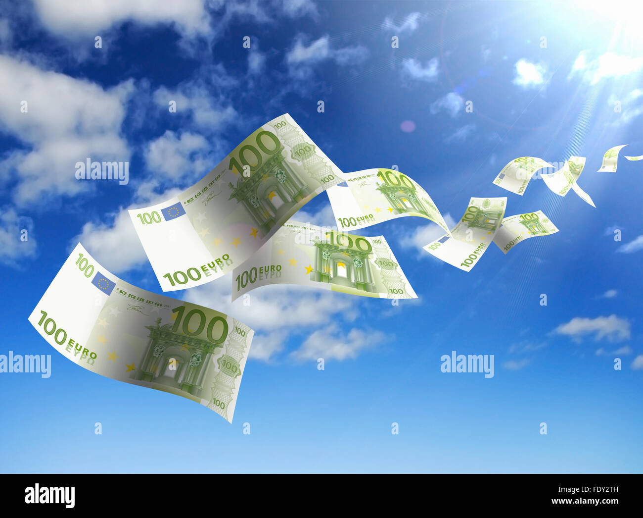 Dollar bills fly in flocks in the sky against a background of white ...