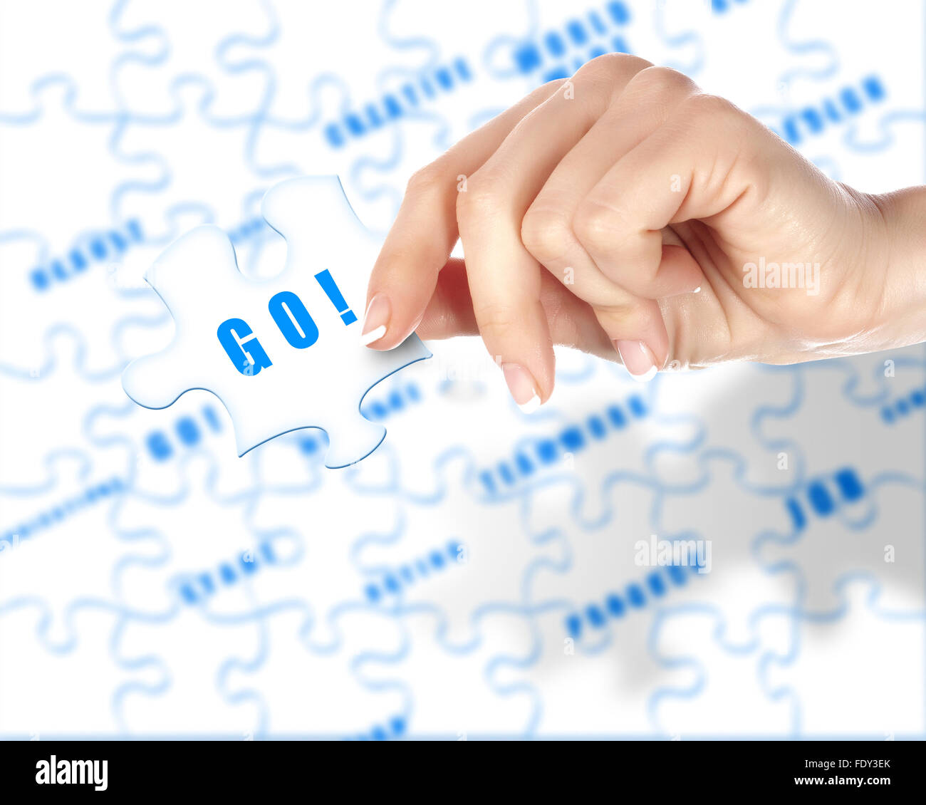 Human hand holding a piece of puzzle with business word Stock Photo - Alamy