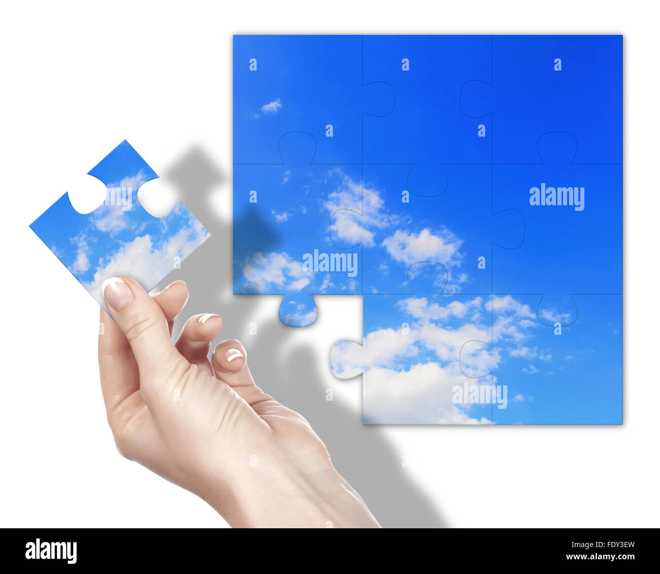 Image of a puzzle with blue sky and white clouds Stock Photo - Alamy