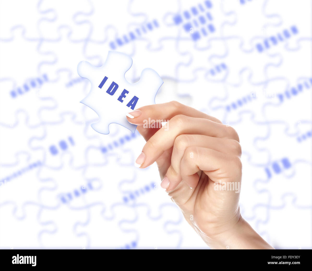 Human hand holding a piece of puzzle with business word Stock Photo - Alamy